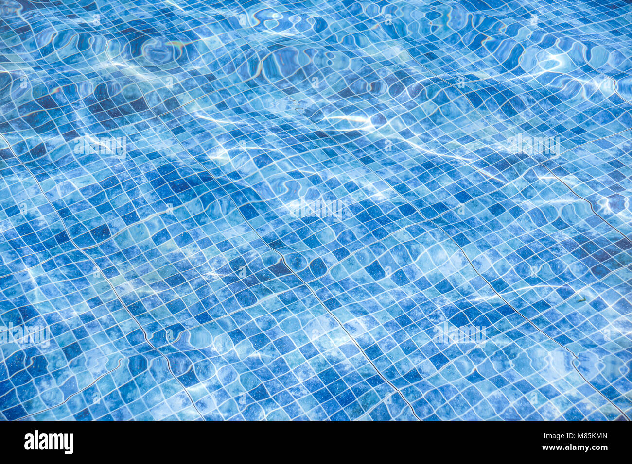 Ripple Water in swimming pool with sun reflection Stock Photo - Alamy