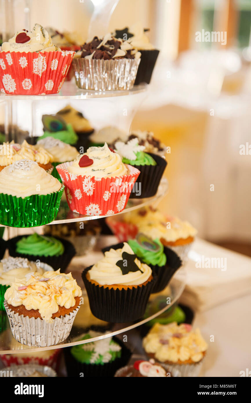 Colourful cupcakes at an event presented on a cake stand Stock Photo ...