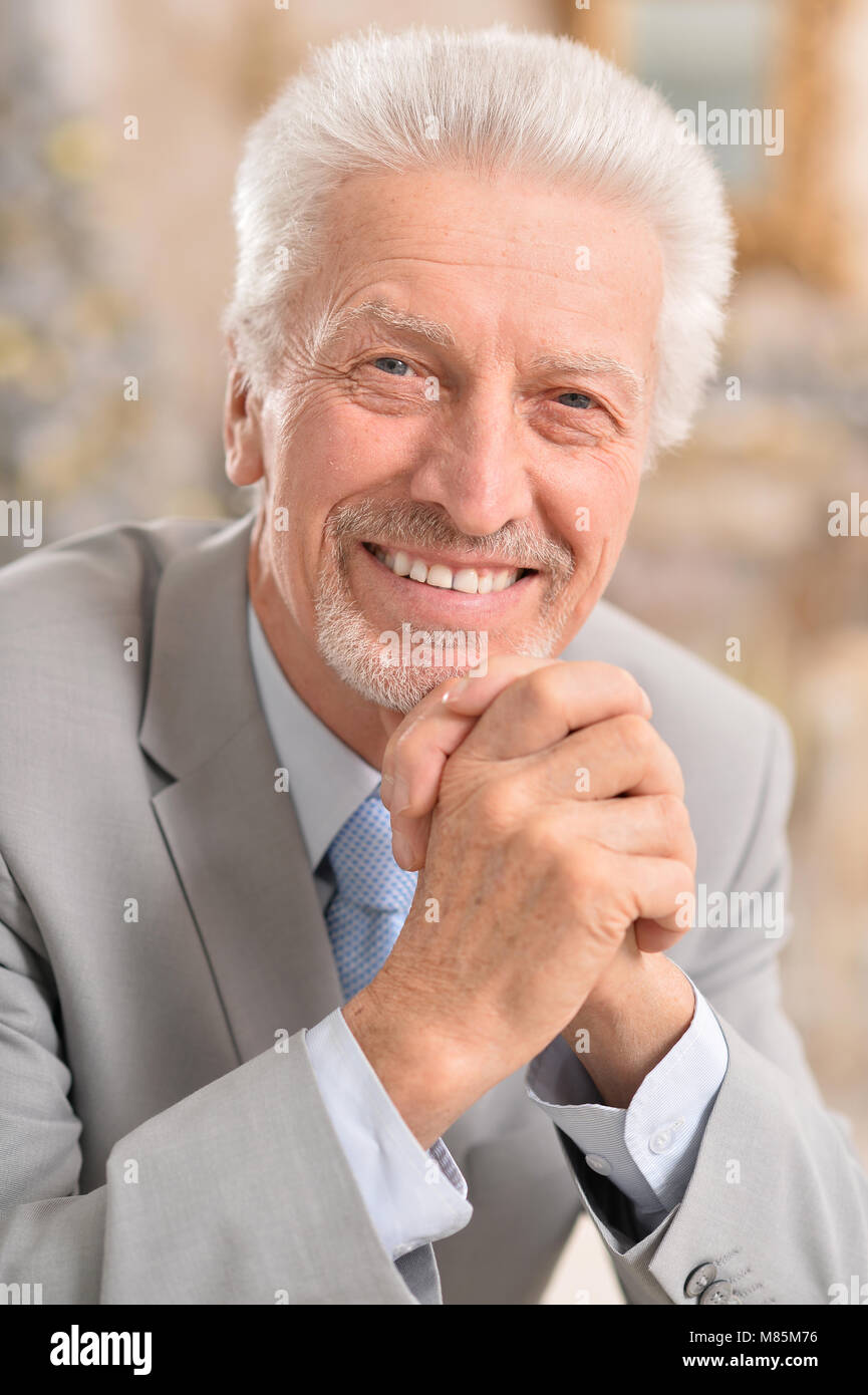 senior man thinking indoors Stock Photo - Alamy