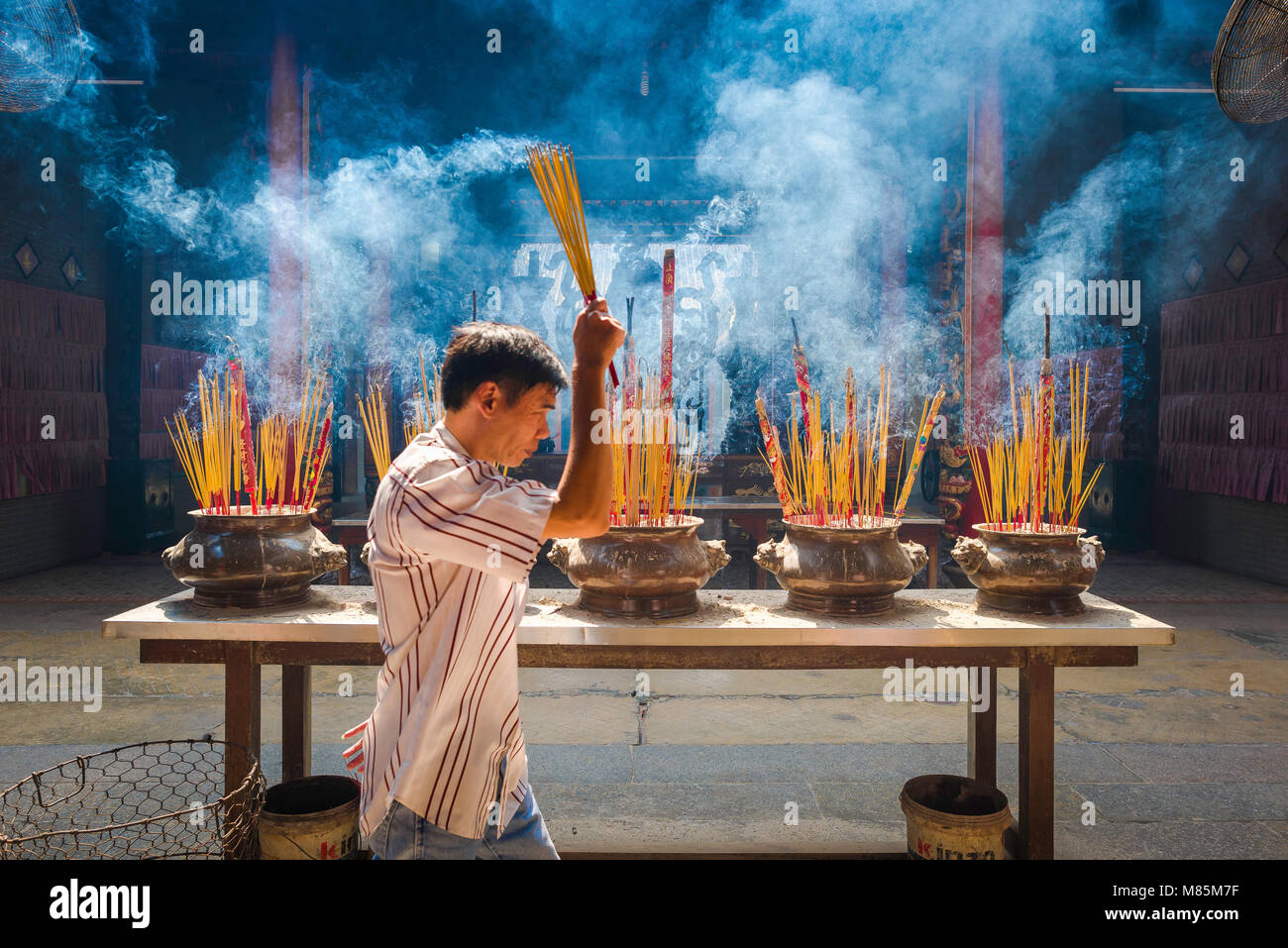 Asia man praying at temple hi-res stock photography and images - Alamy