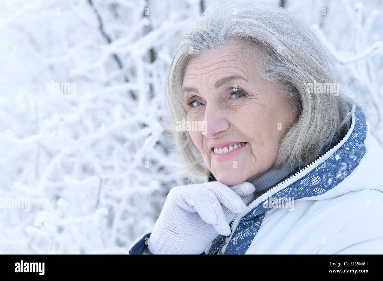mature woman in winter posing outdoors Stock Photo - Alamy