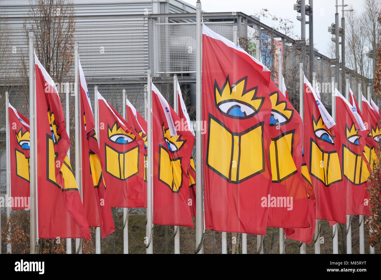 14 March 2018, Germany, Leipzig: Flags featuring the logo of the ...