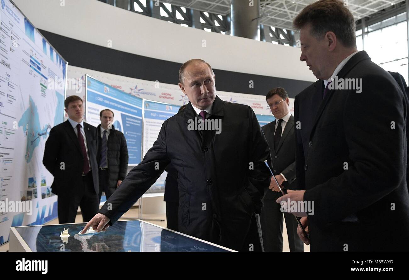 Russian President Vladimir Putin tours the new passenger terminal of ...