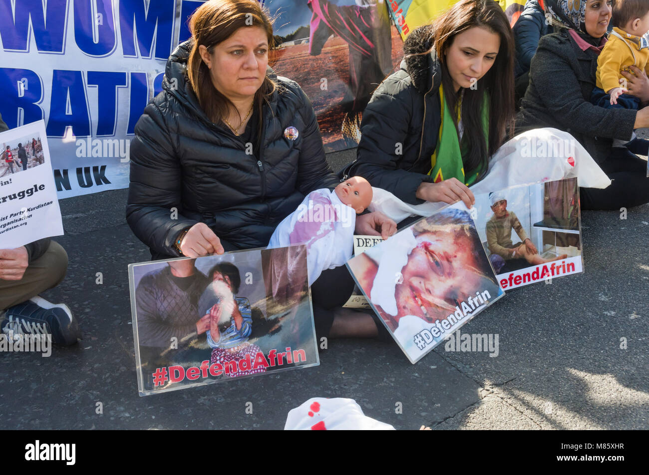 London, UK. 14th March 2018. Dolls wrapped in shrouds represent ...