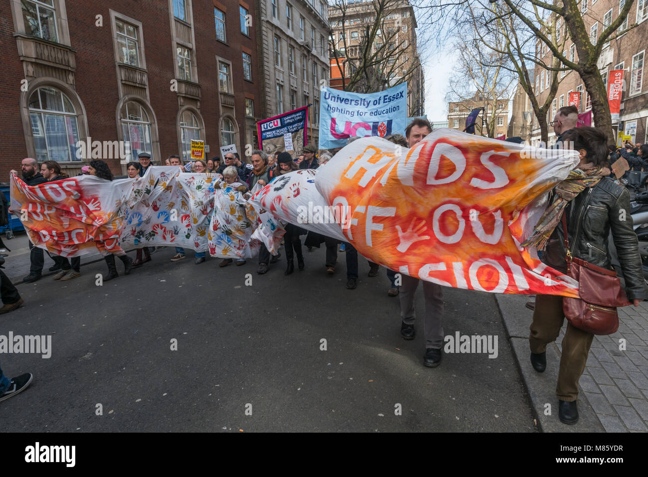 London, UK. 14th March 2018. A very long banner covered with handprints ...
