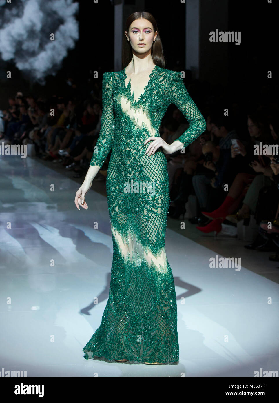 Toronto, Canada. 14th Mar, 2018. A model presents a creation by Mikael ...