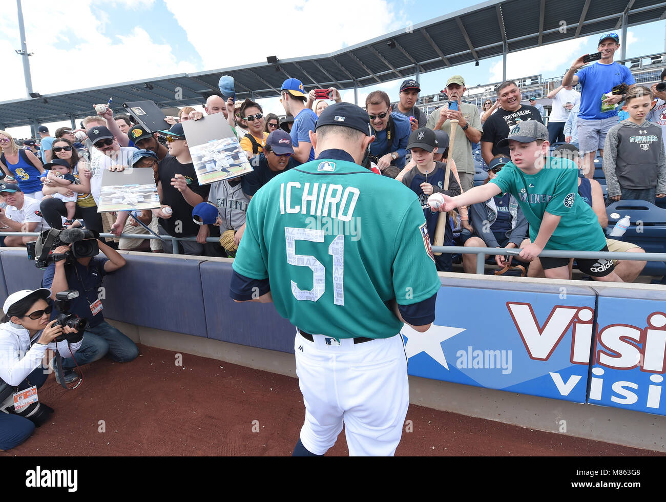 Ichiro Suzuki of the Seattle Mariners signs autographs for fans before ...