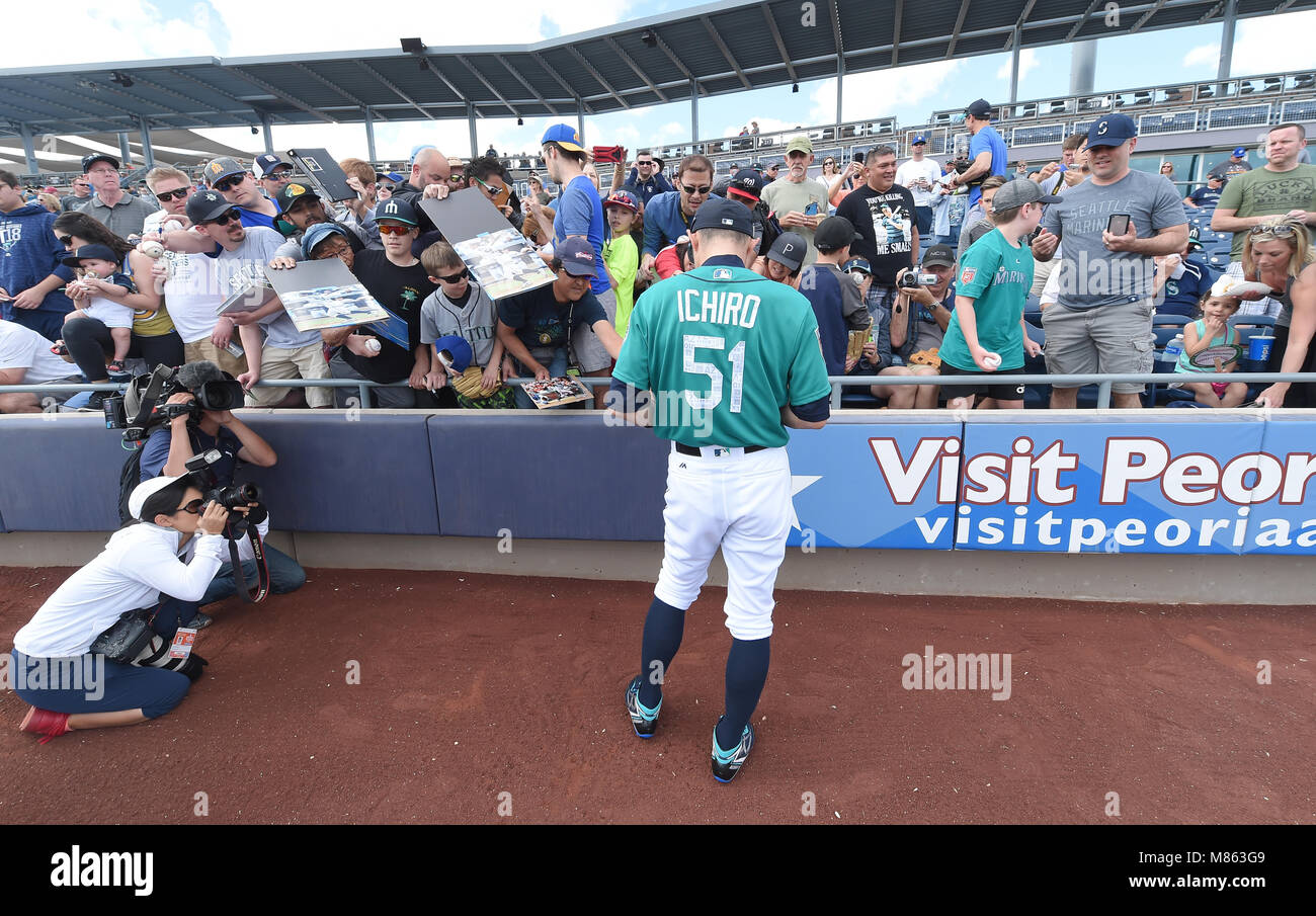 Ichiro Suzuki of the Seattle Mariners signs autographs for fans before ...