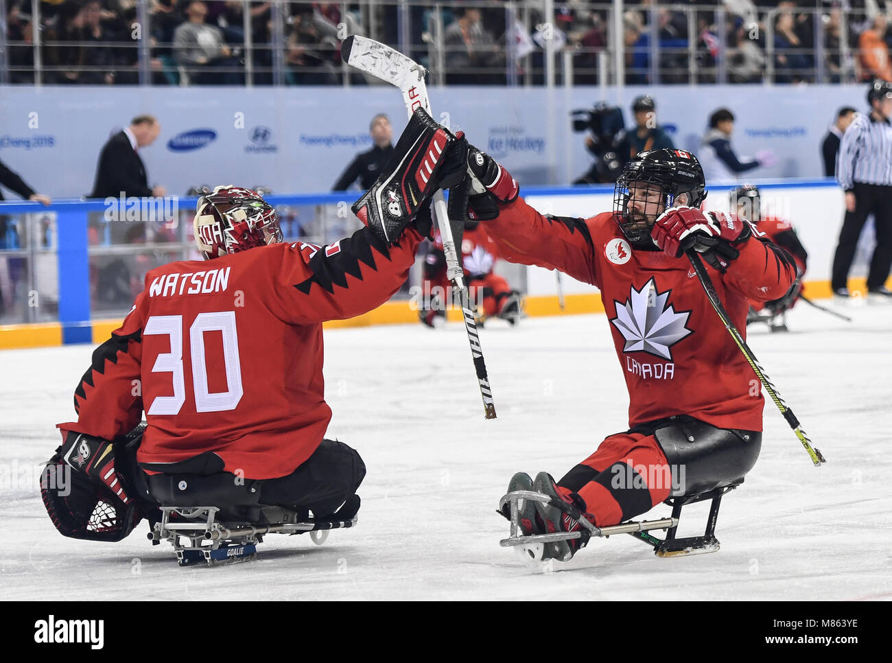 Gangneung, South Korea. 15th Mar, 2018. Billy Bridges (R) of Canada ...