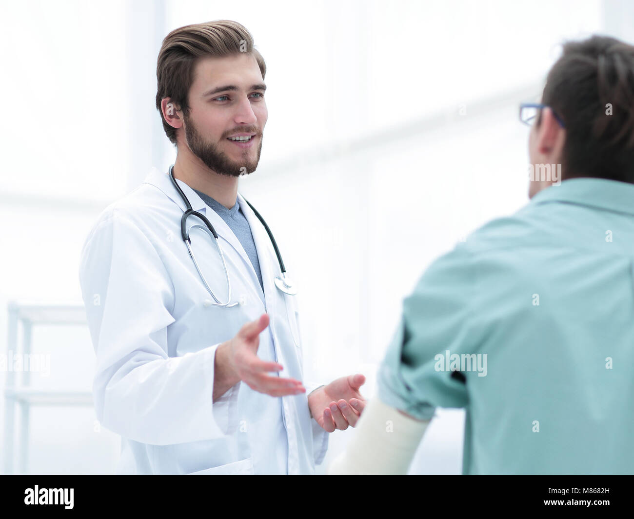 doctor talking with a patient Stock Photo - Alamy