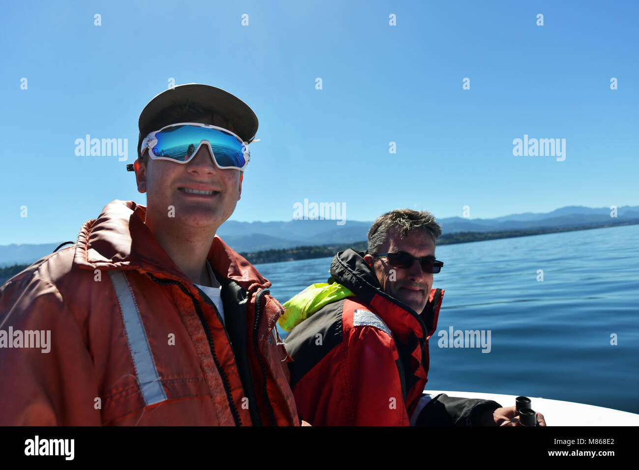 Father and son Whale watching off the coast of Vancouver Island ...