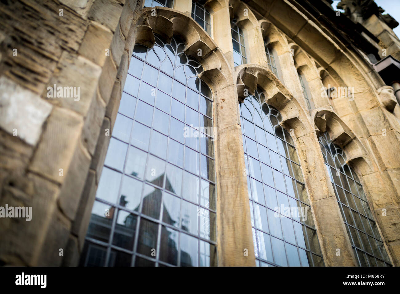 Historic gothic leaded and decorative arched windows in an ancient ...