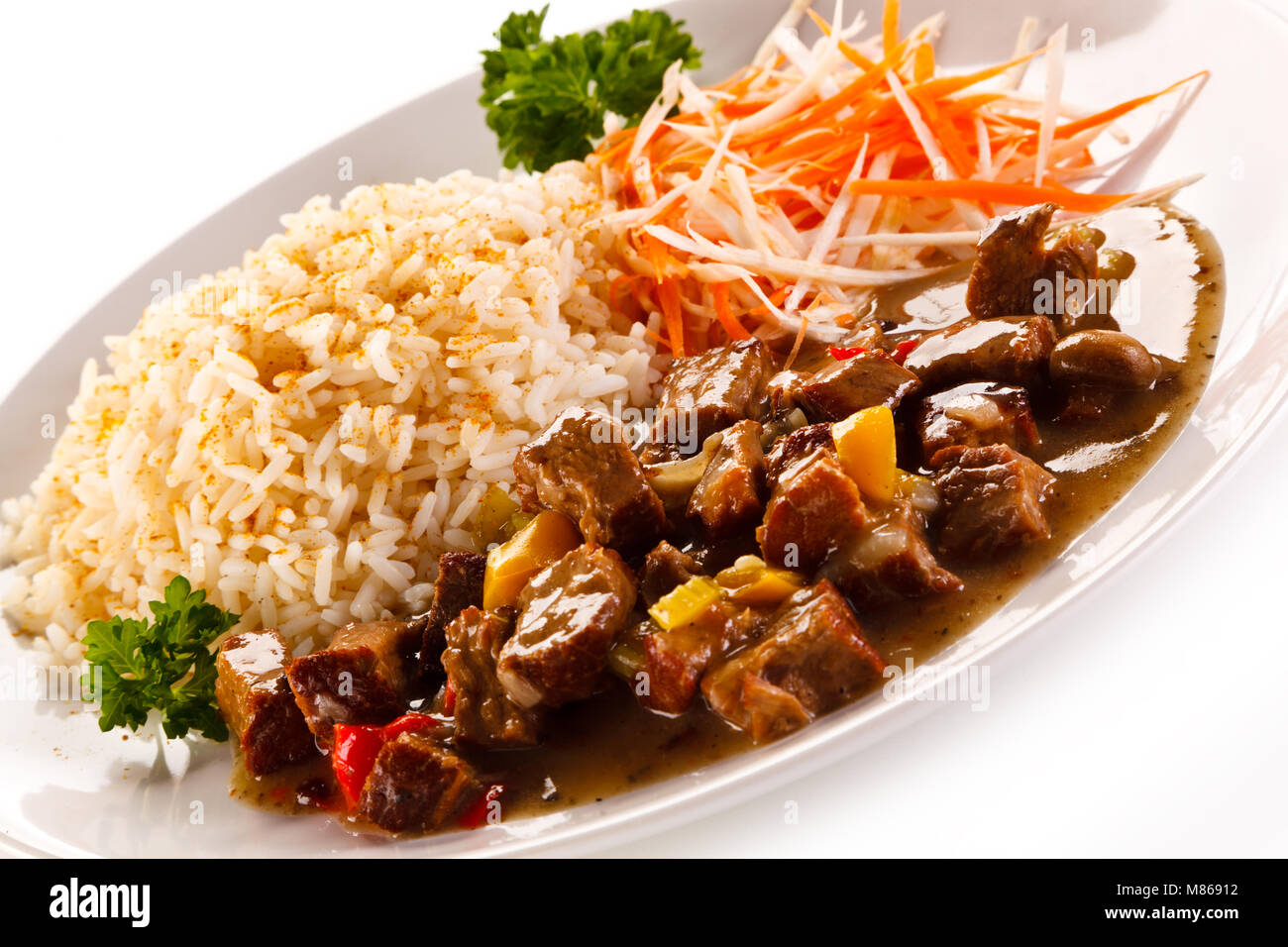 Roasted meat, white rice and vegetables Stock Photo - Alamy