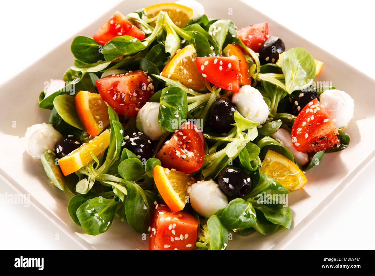Caprese salad on white background Stock Photo - Alamy