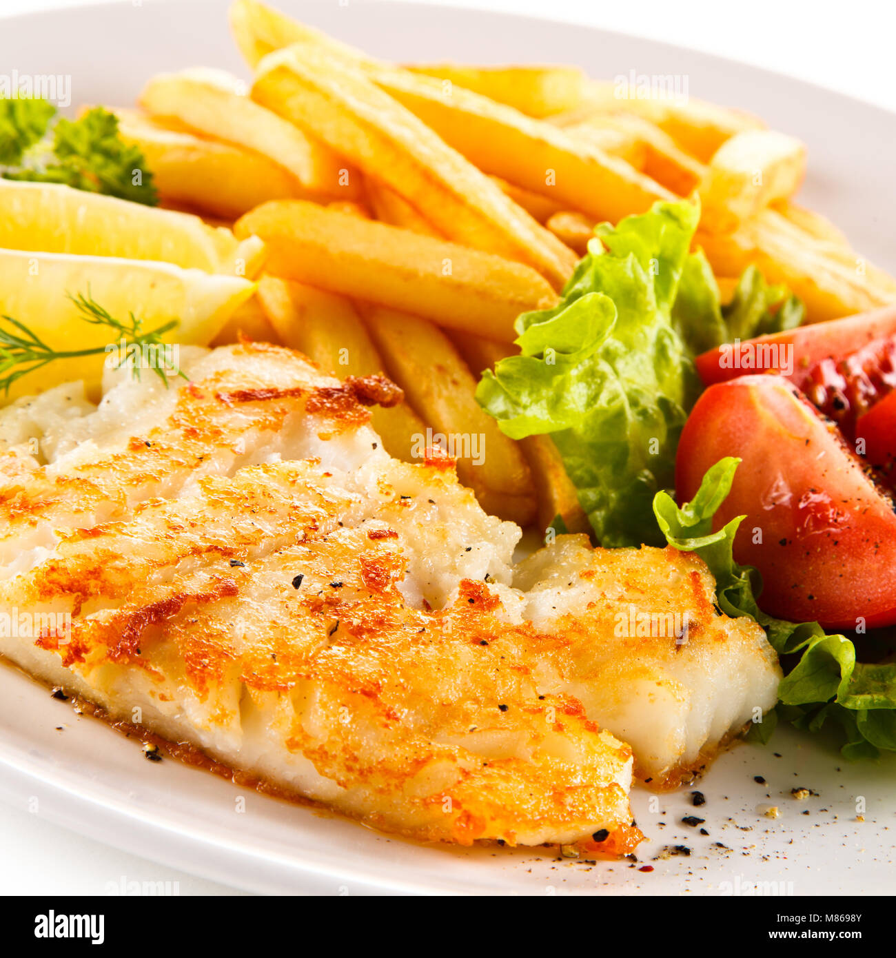 Fried fish fillet with french fries on white background Stock Photo - Alamy