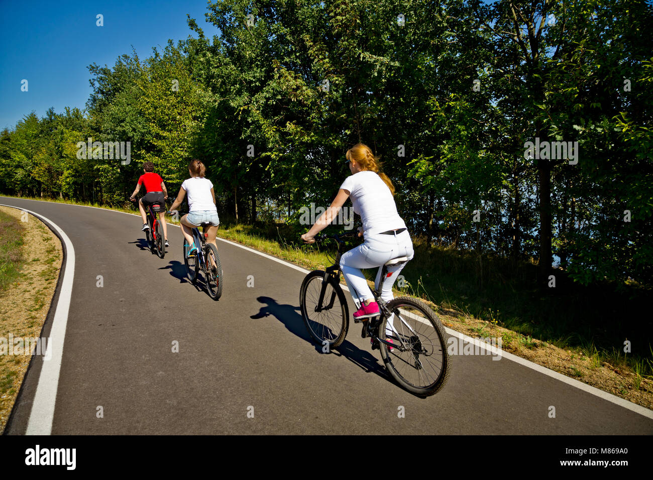 Healthy lifestyle - people riding bicycles Stock Photo - Alamy