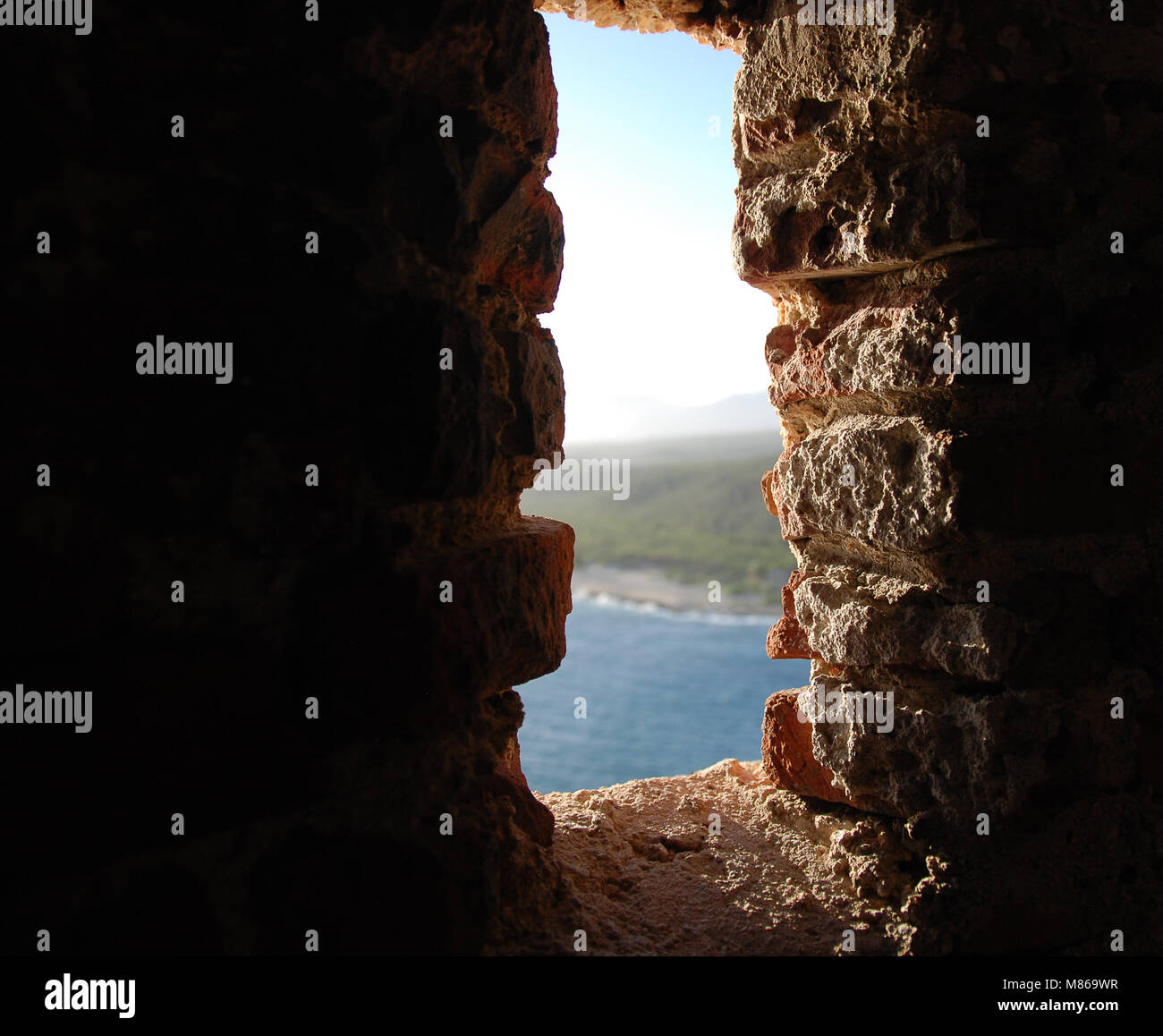 Rock window with lookout to ocean and coast Stock Photo - Alamy