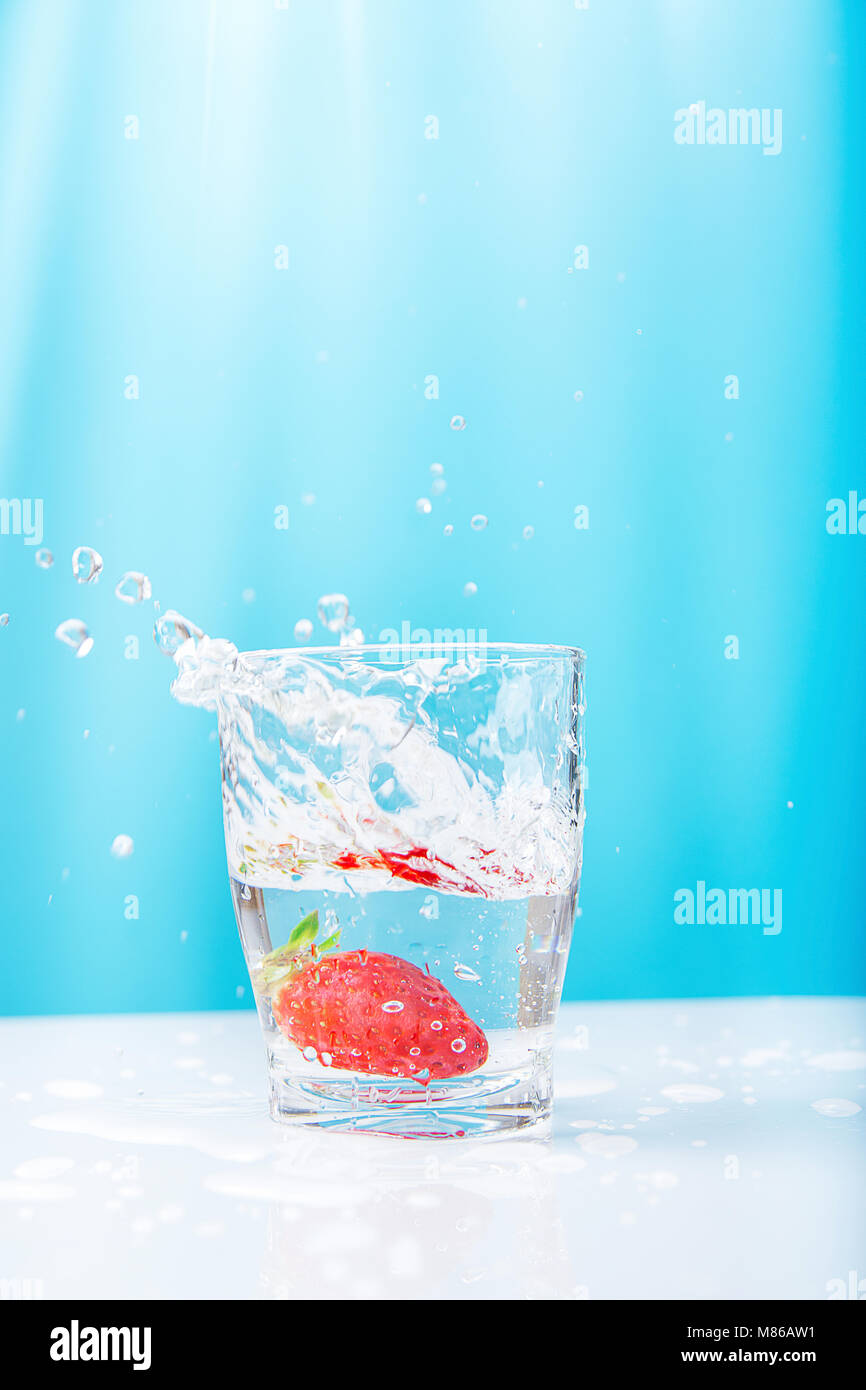 Process of Falling of Ripe Juicy Floating Strawberry into Glass of ...