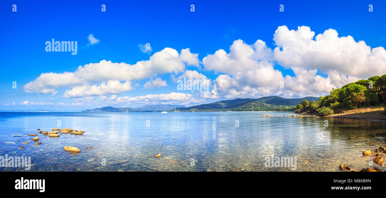 Rocks and yachts in a sea bay. Punta Ala beach, Maremma Tuscany, Italy ...