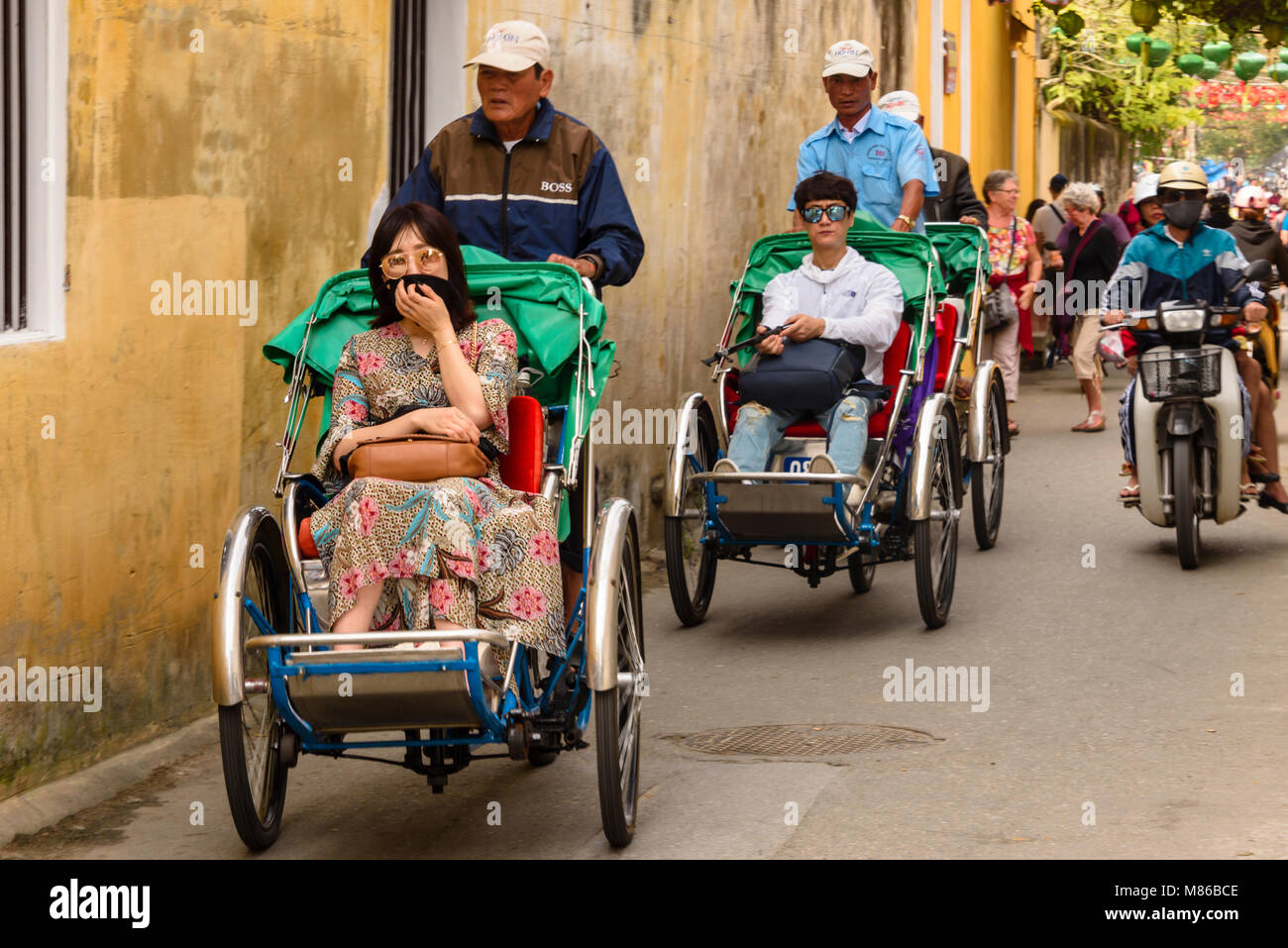 Visitors on rickshaws in Hoi An, Vietnam Stock Photo - Alamy