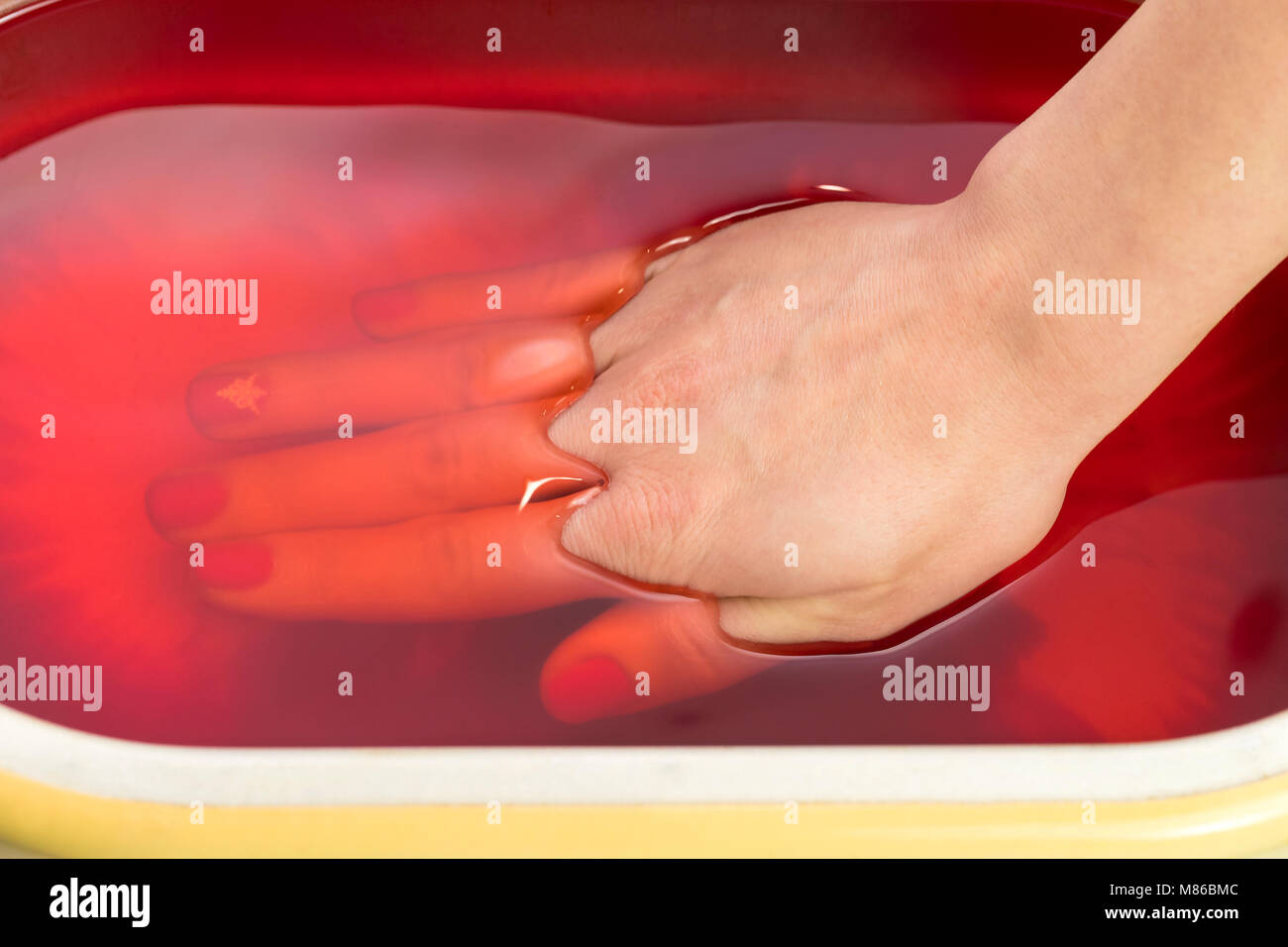 Process paraffin treatment of female hands in beauty salon Stock Photo ...