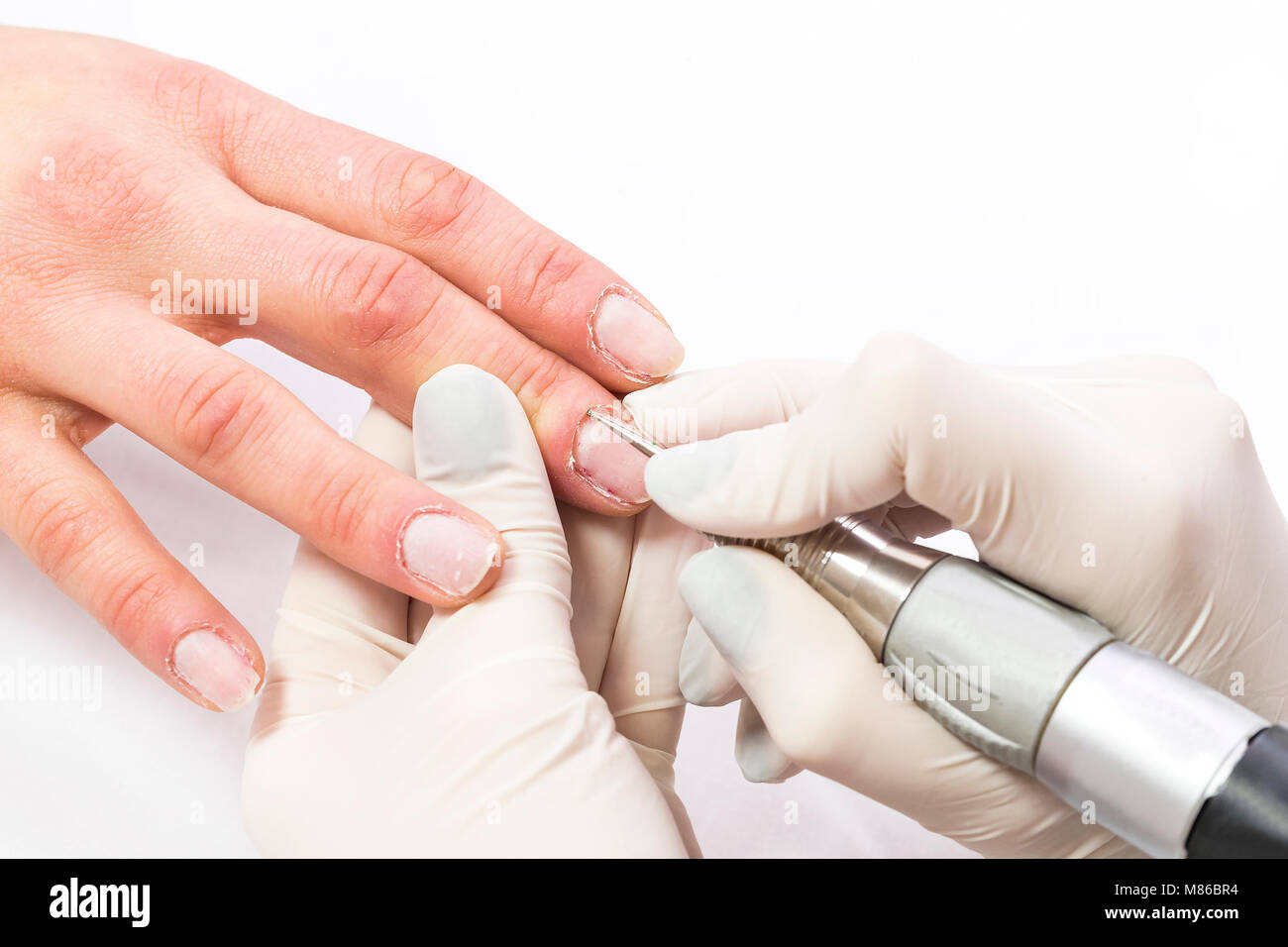 The process of the master's work in the manicure salon of female nails ...