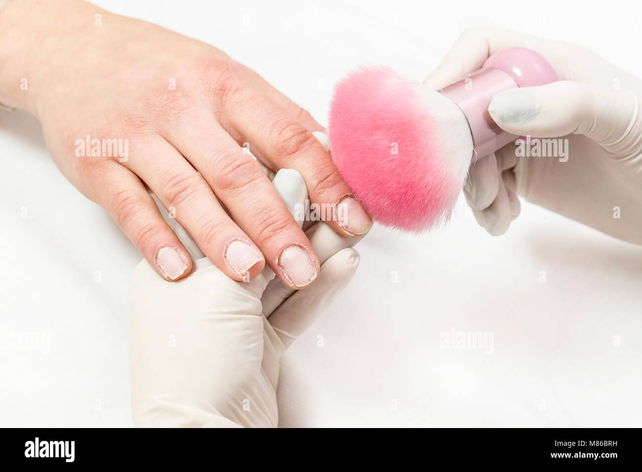 The process of the master's work in the manicure salon of female nails ...