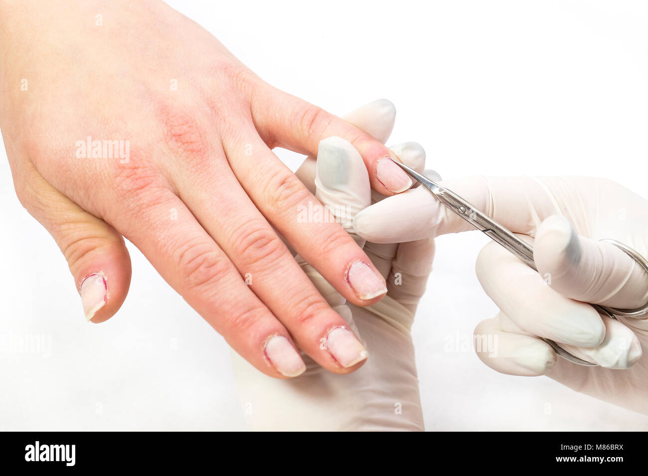 The process of the master's work in the manicure salon of female nails ...