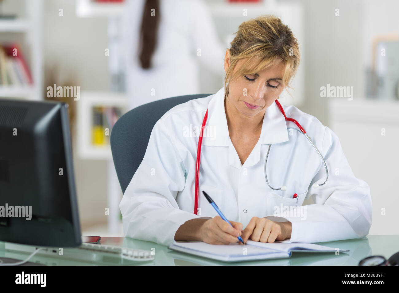 Serious focused caucasian female doctor hi-res stock photography and ...