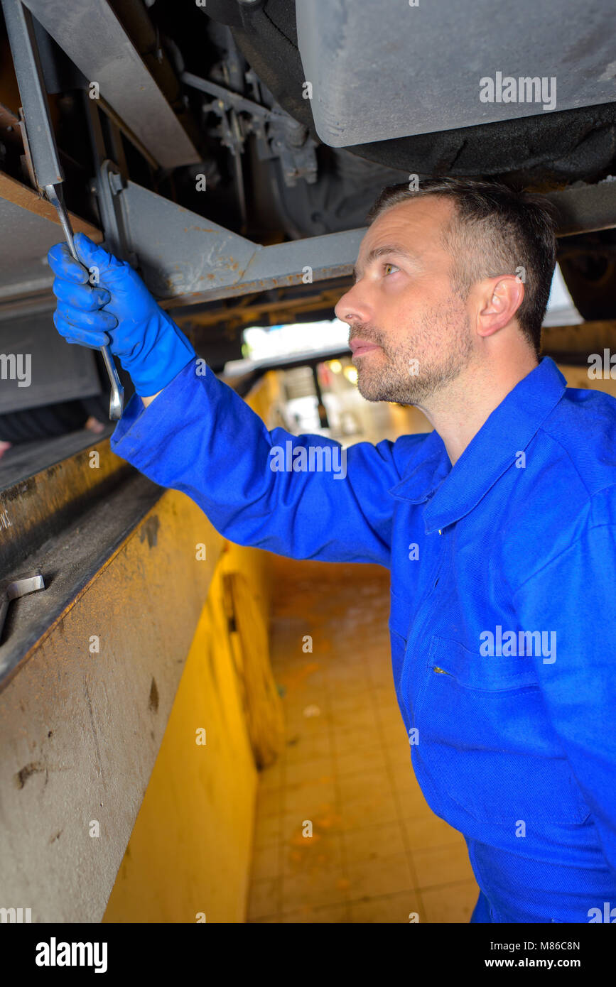 mechanic in pit Stock Photo - Alamy