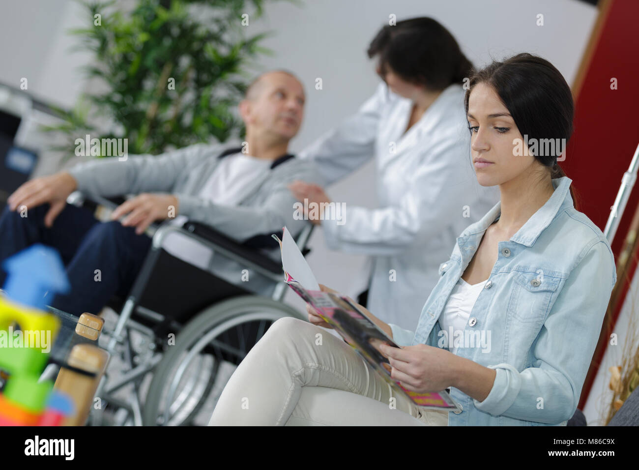 Woman waiting in check up room hi-res stock photography and images - Alamy