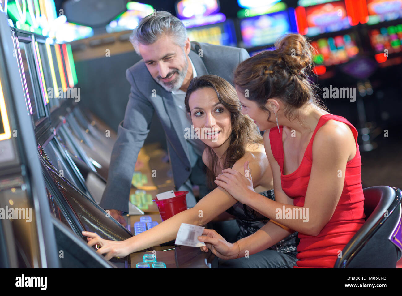 People playing gambling machines in hi-res stock photography and images ...