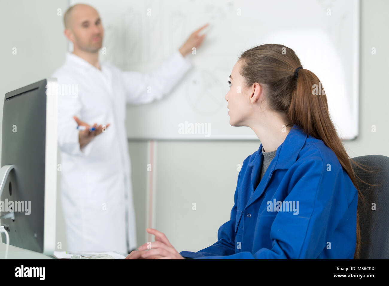 Female teacher asking student hi-res stock photography and images - Alamy