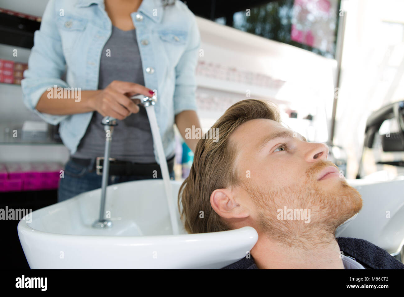 man having hair washed in beauty salon Stock Photo - Alamy