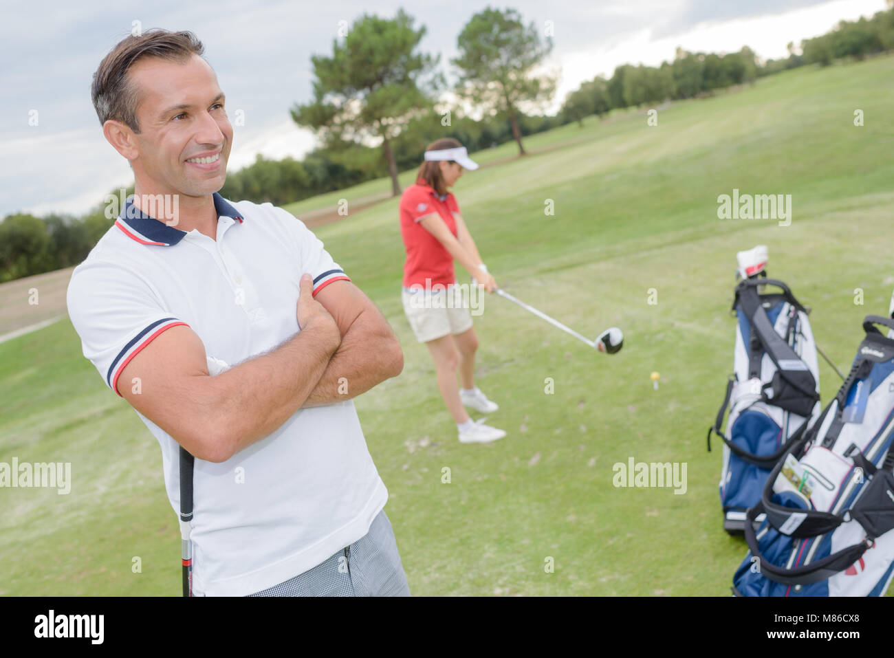 golf pro working as a teacher e Stock Photo - Alamy