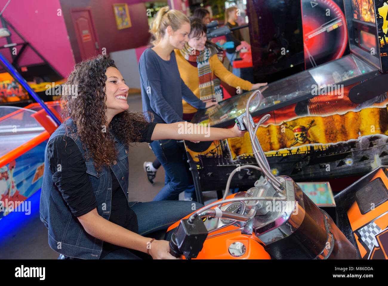Woman playing video games standing hi-res stock photography and images ...