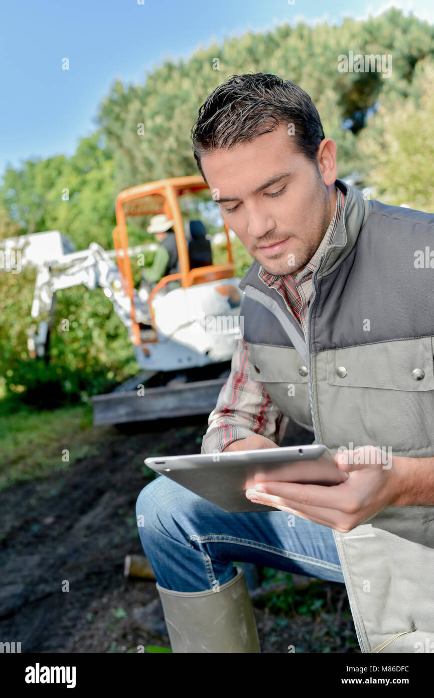 gardener outside with tablet Stock Photo - Alamy