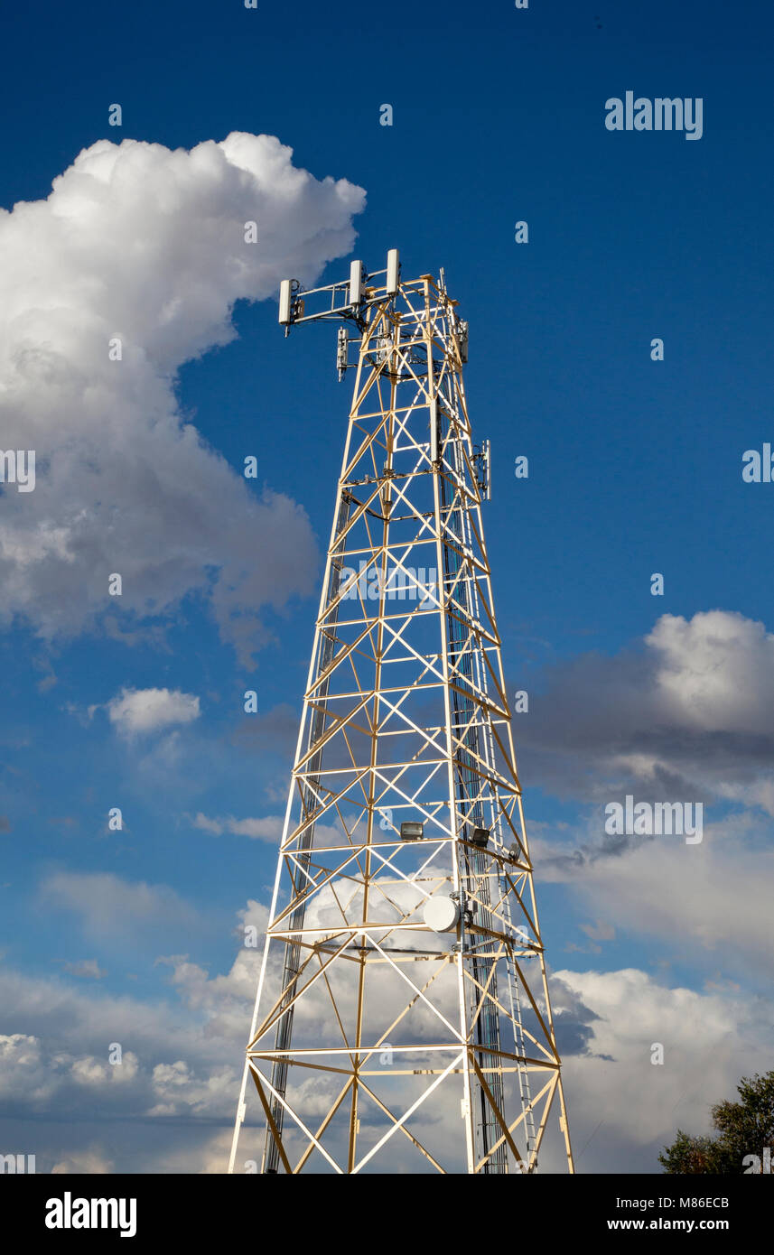 Cellular telephone antenna tower against blue sky with clouds, 2017 Stock Photo - Alamy