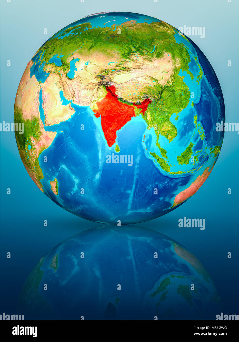 India in red on model of planet Earth on reflective blue surface. 3D ...