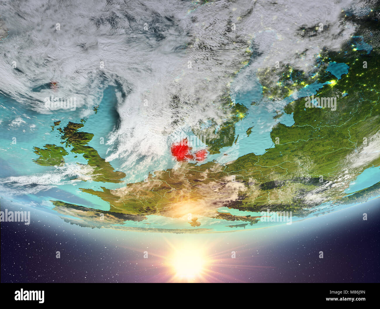 Denmark during sunrise highlighted in red on planet Earth with clouds. 3D illustration. Elements ...
