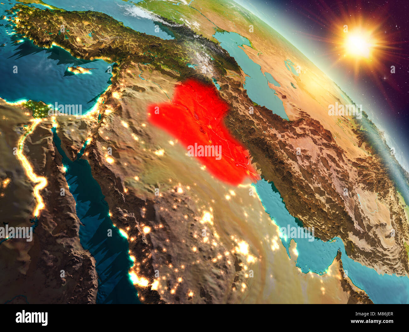 Sunrise above Iraq highlighted in red on model of planet Earth in space ...