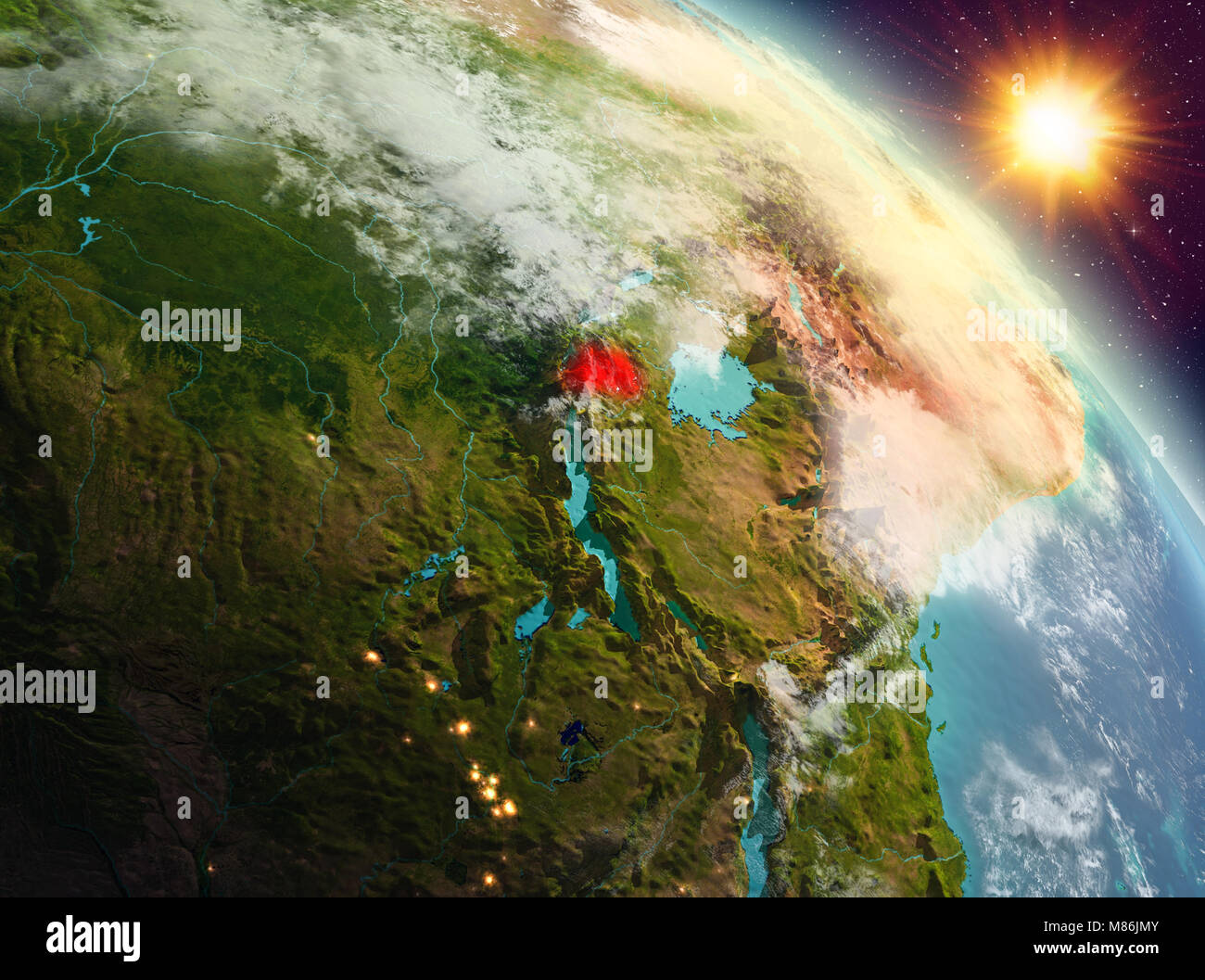 Sunrise above Rwanda highlighted in red on model of planet Earth in space. 3D illustration ...