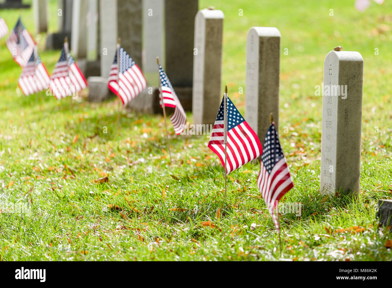 Small US flags in front of headstones in Arlington National Cemetery ... Small US flags in front of headstones in Arlington National Cemetery ...