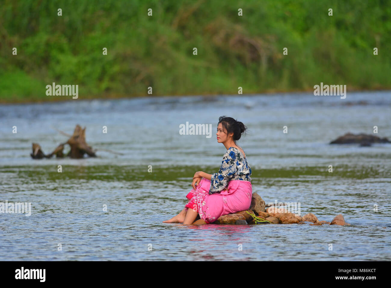 Portrait of young girl in river, Young girl posing on the water Stock ...