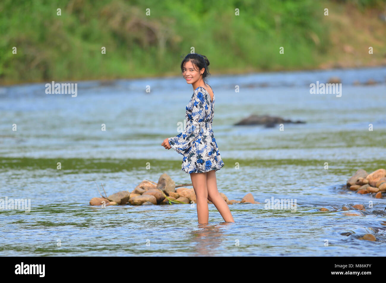 Portrait of young girl in river, Young girl posing on the water Stock ...