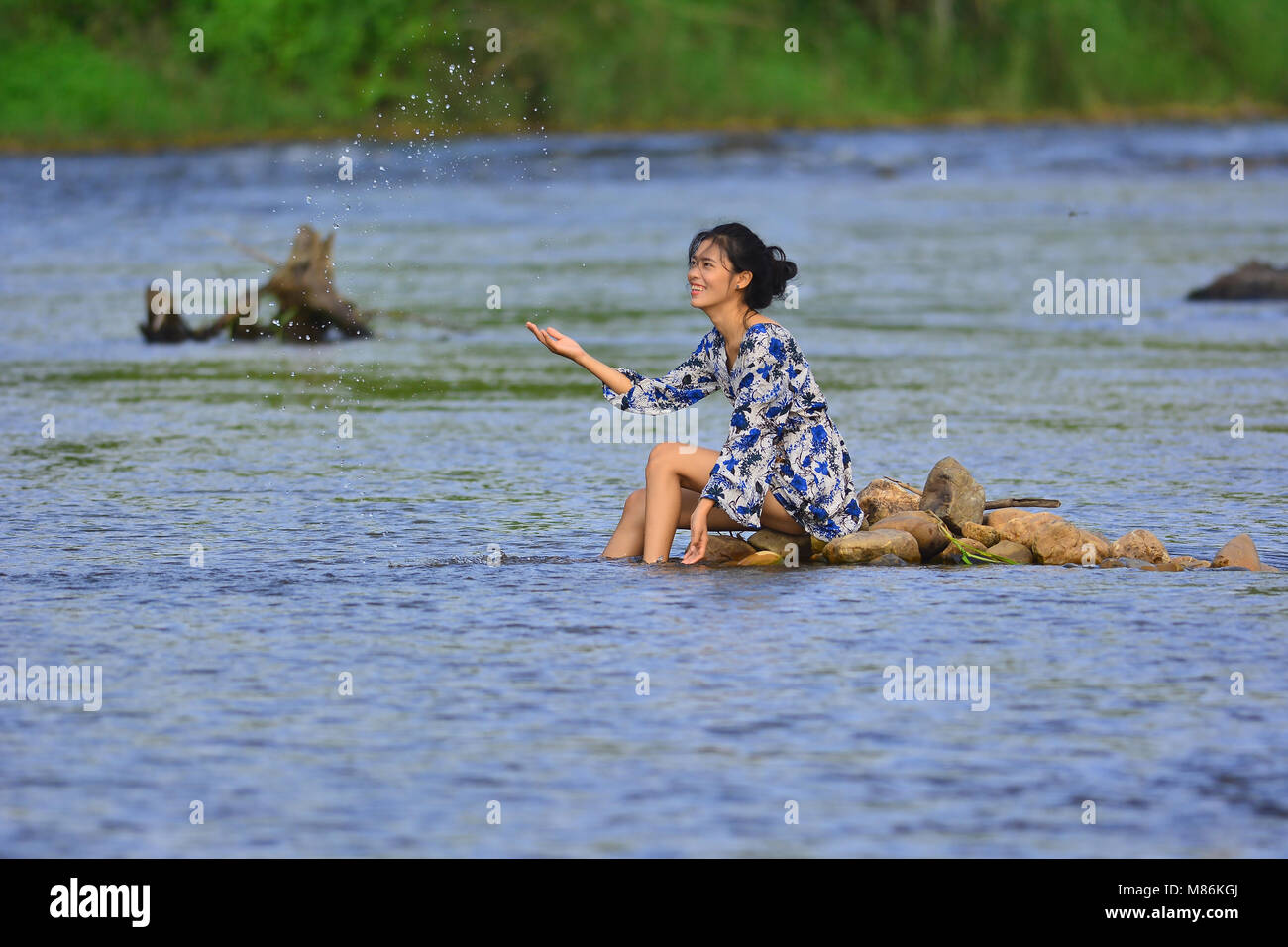 Portrait of young girl in river, Young girl posing on the water Stock ...