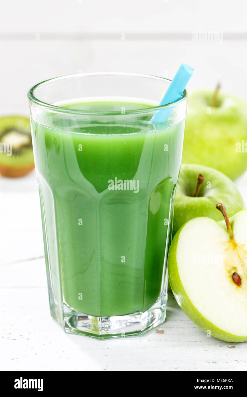 Green smoothie juice apple kiwi spinach glass portrait format fruit ...