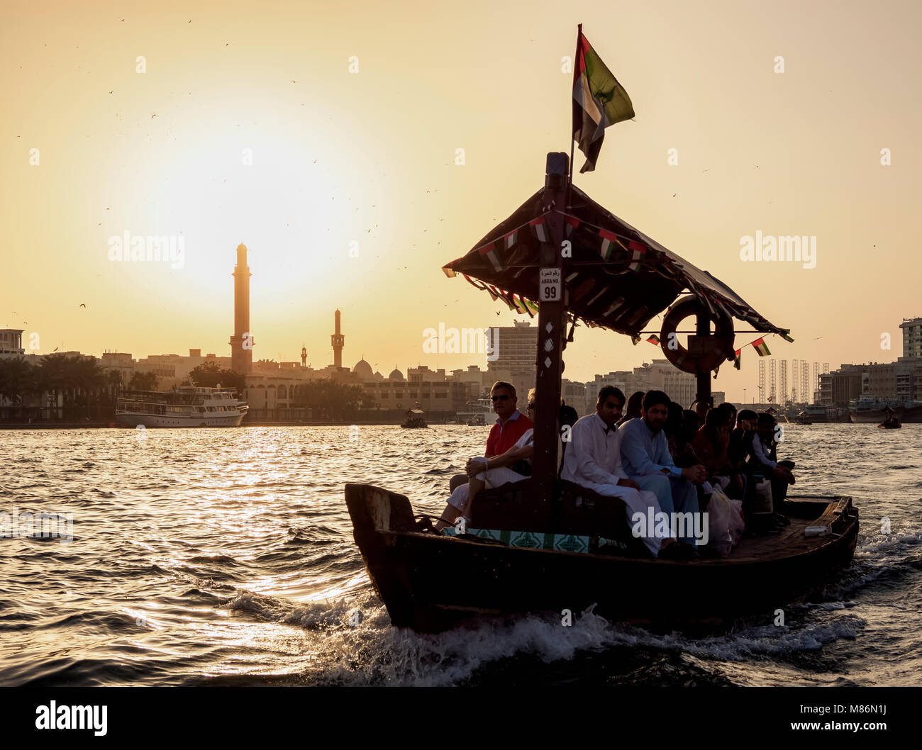 Abra Boat on Dubai Creek at sunset, Dubai, United Arab Emirates Stock ...