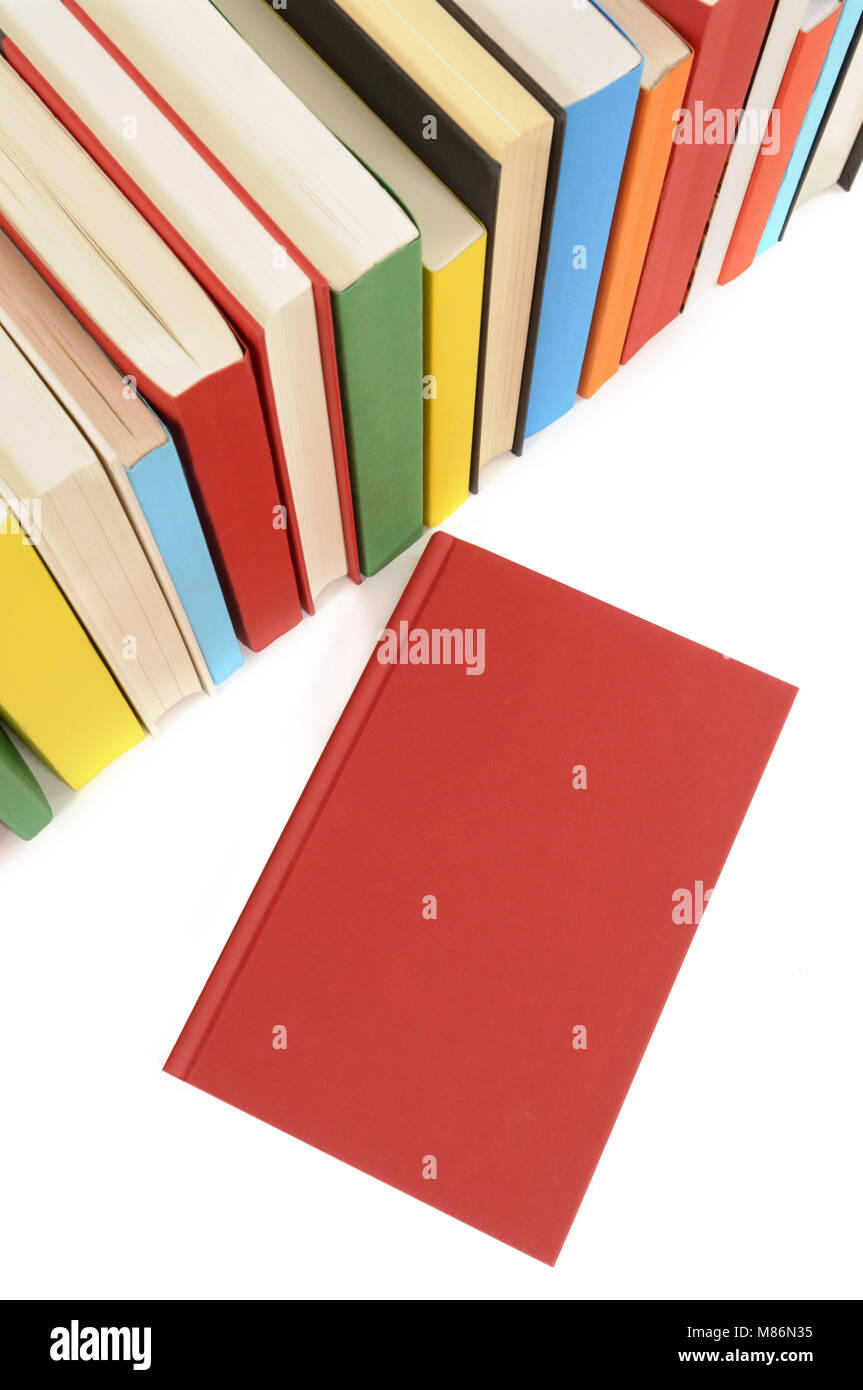 Plain red book with row of colorful books isolated on a white ...