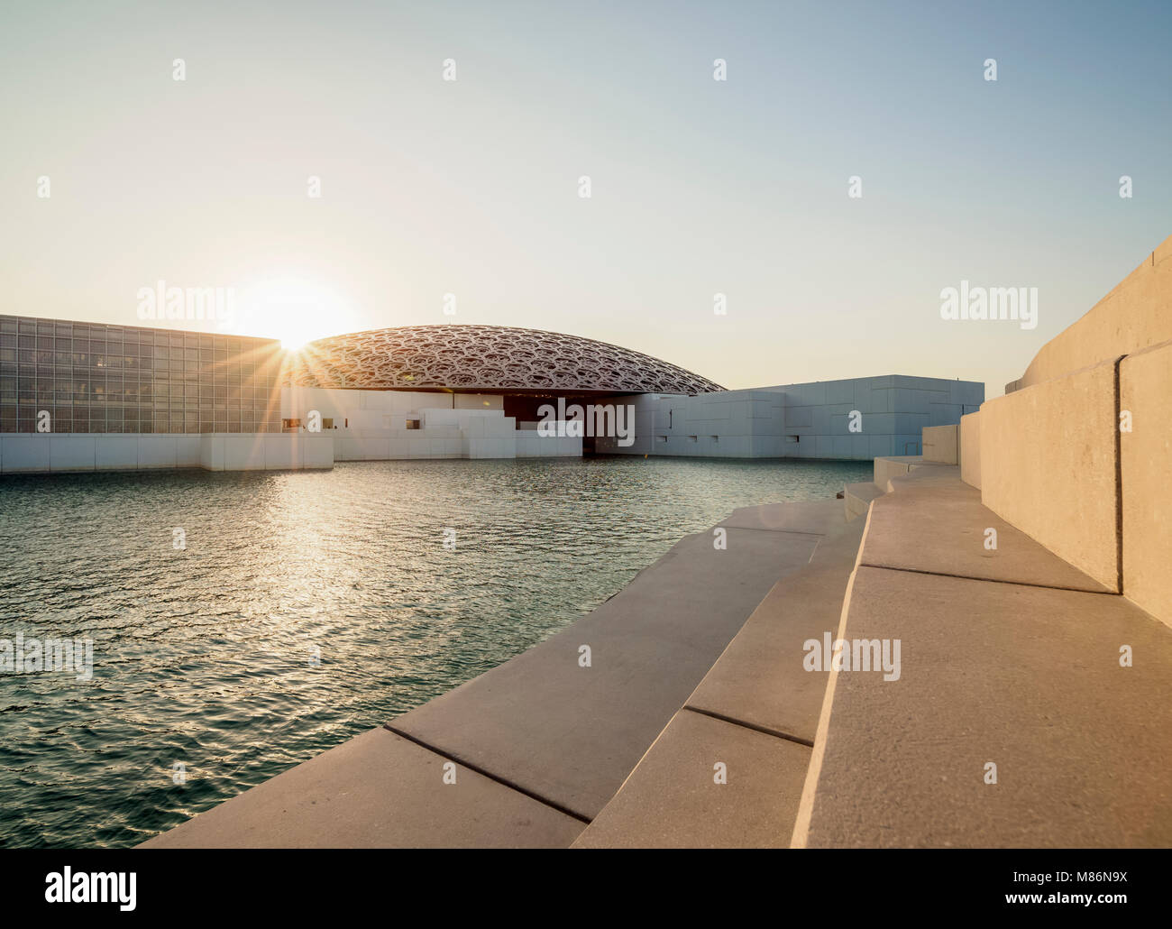 Louvre Museum at sunset, Abu Dhabi, United Arab Emirates Stock Photo ...
